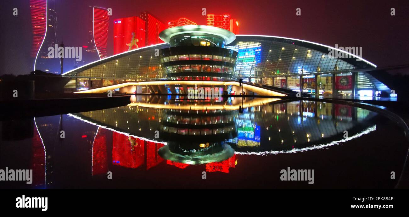 Buildings with LED lights on and their reflections on the Qiantang ...
