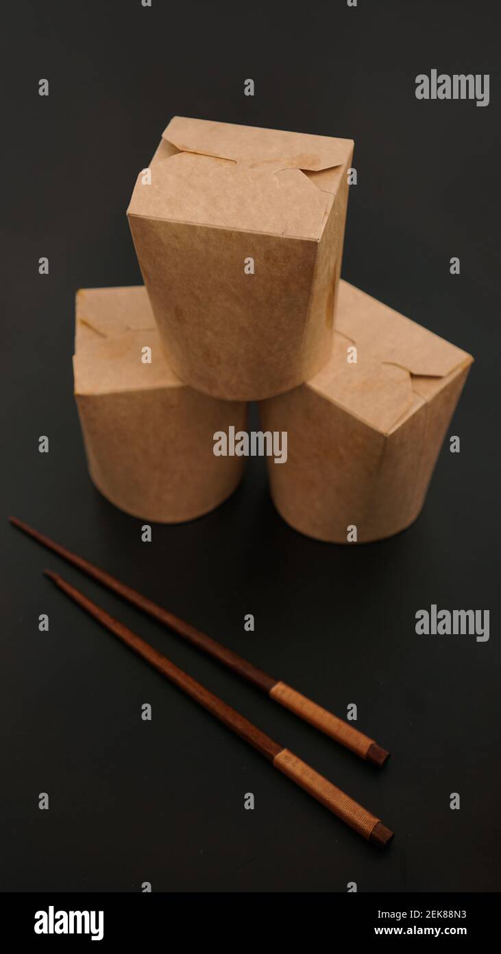 Brown paper cardboard food container on black background. Asian food ...
