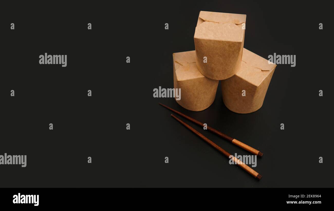 Brown paper cardboard food container on black background. Asian food ...