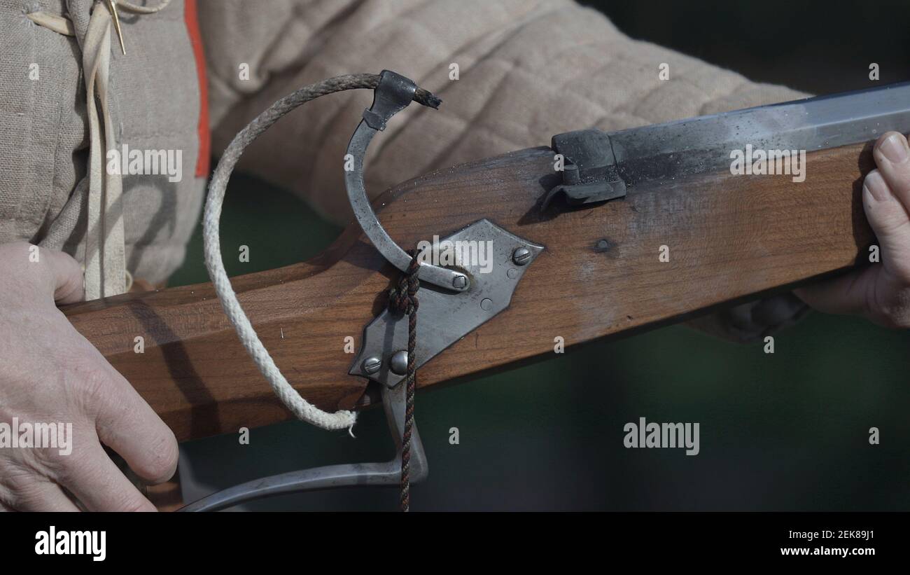 Medieval handgunner fires his matchlock musket Stock Photo - Alamy