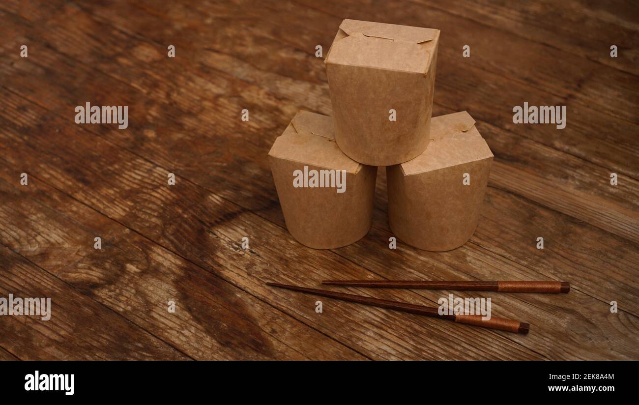 Brown paper cardboard food container on wooden background. Asian food ...