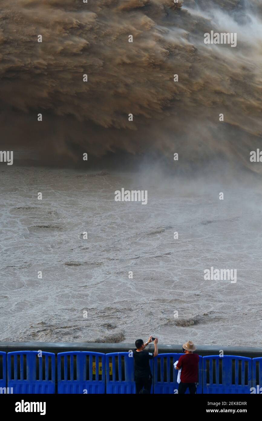 Aerial view of Xiaolangdi Dam discharging flood and sand after days of ...
