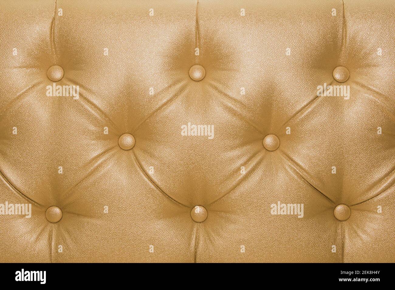 Yellow or gold leather upholstery sofa with pattern button design ...