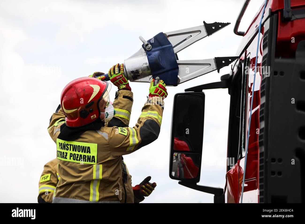 Firefighters breaking the door of a truck cabin during the training ...