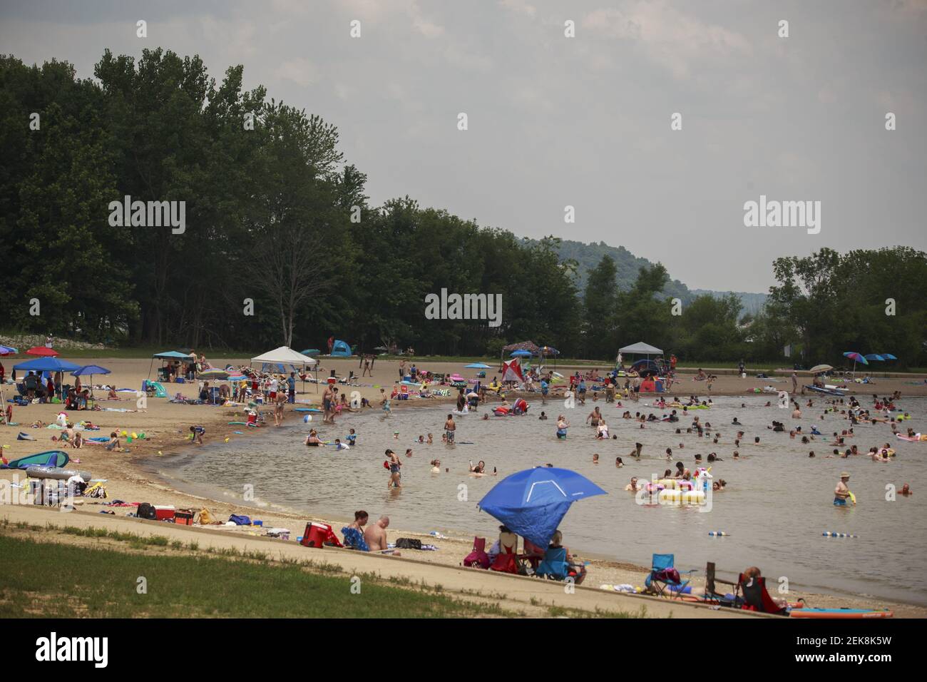 Swimmers fill Lake Monroe at Fairfax Recreation Area beach during the ...