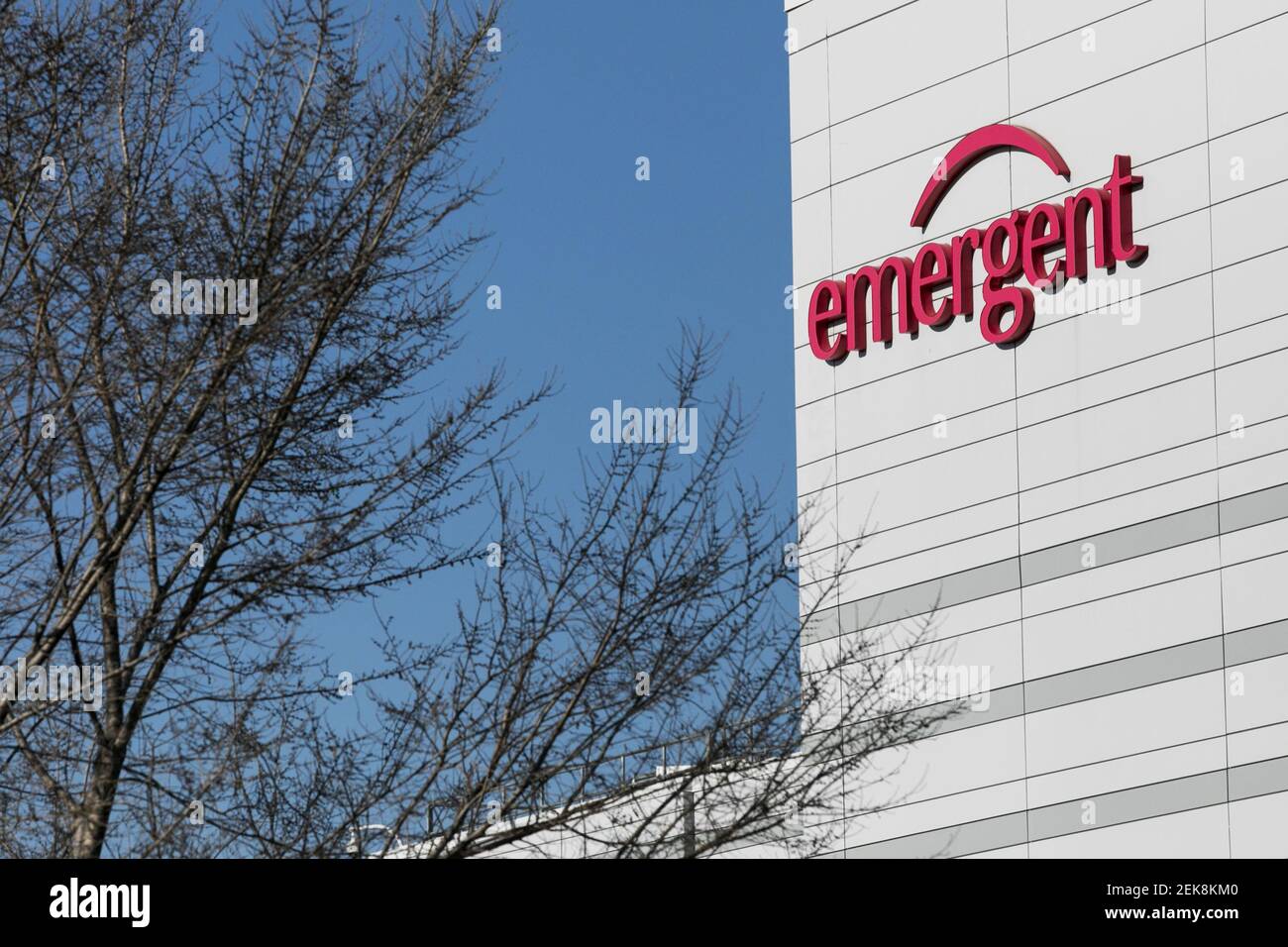 A logo sign outside of a facility occupied by Emergent BioSolutions in ...