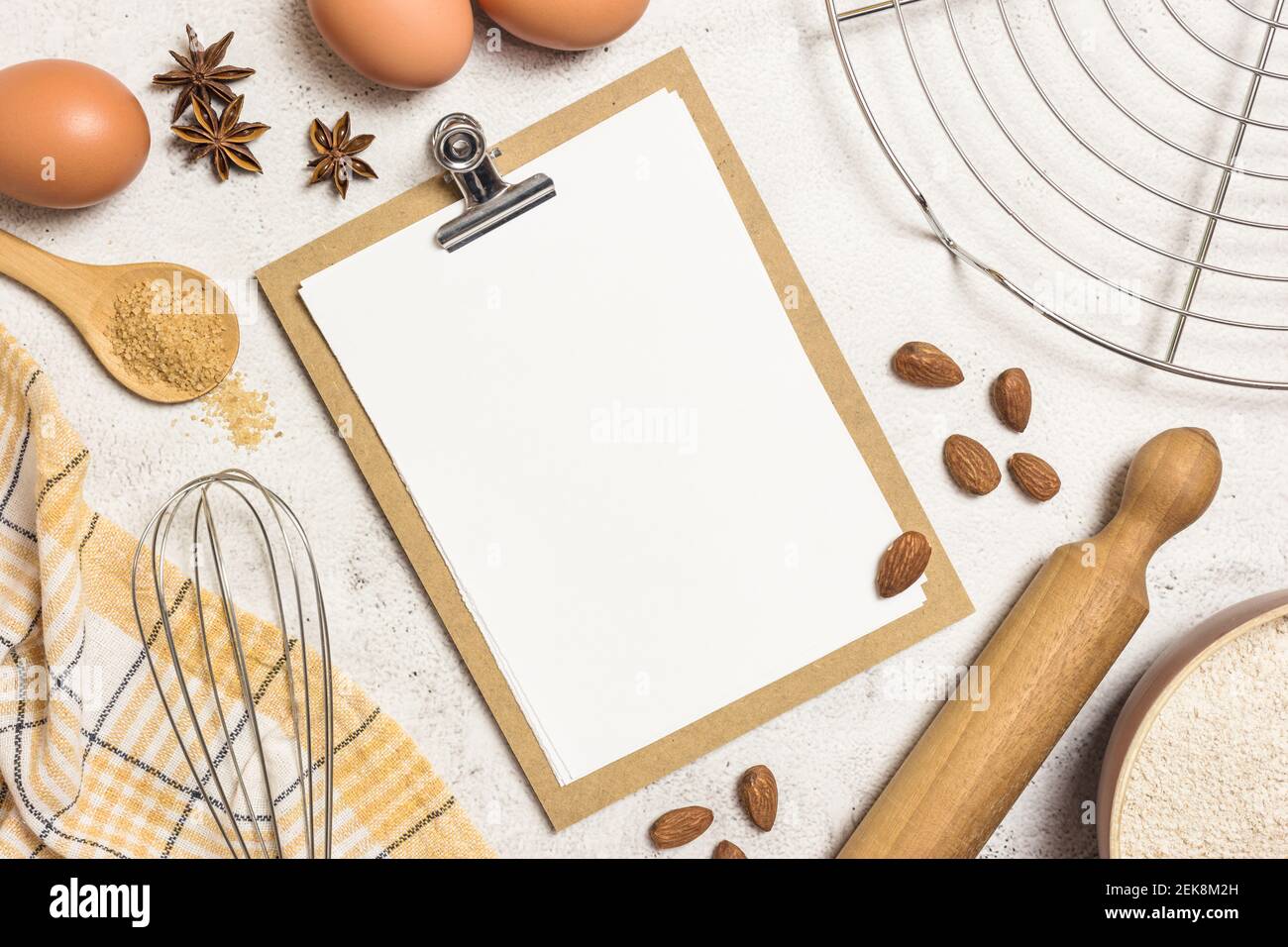Ingredients and utensils for baking cakes with blank sheet for recipes ...
