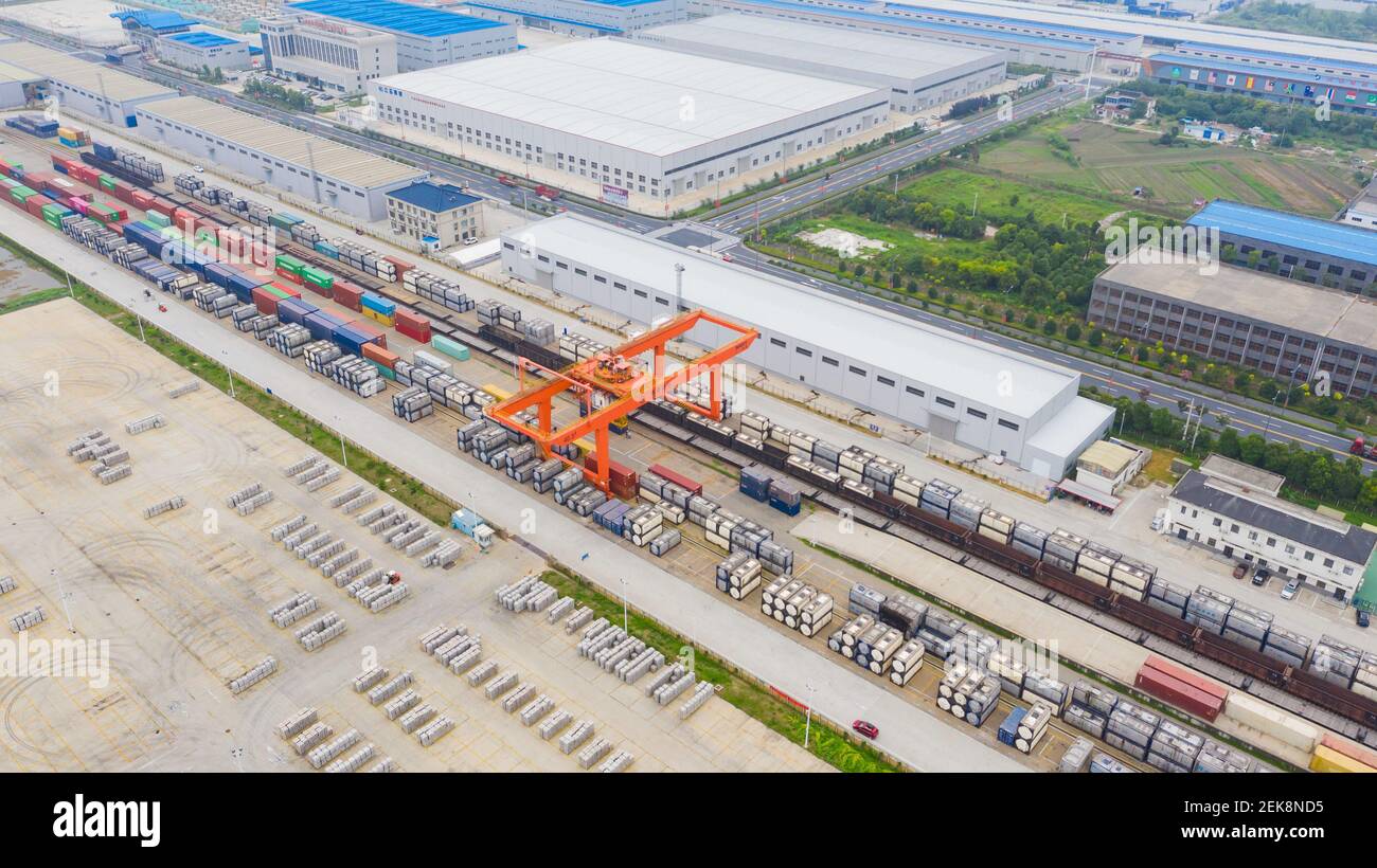 Aerial view of gantry cranes uploading containers at a port of Shanghai ...