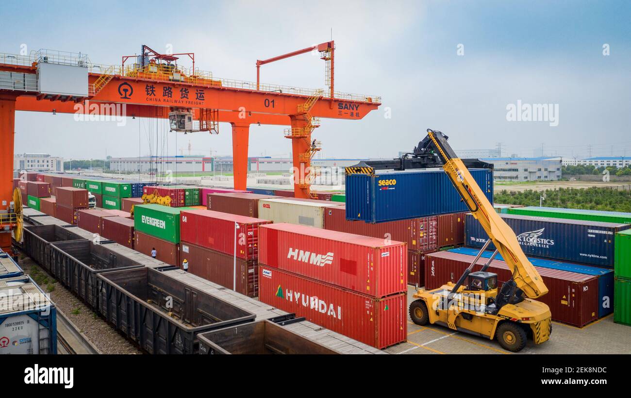 Aerial view of gantry cranes uploading containers at a port of Shanghai ...