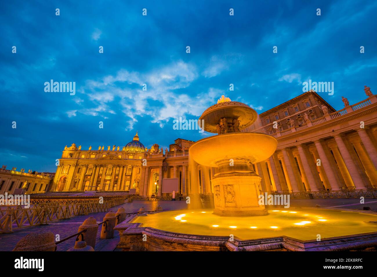 Vatican City and Water Fountain in Dusk with Storm Clouds in Rome ...