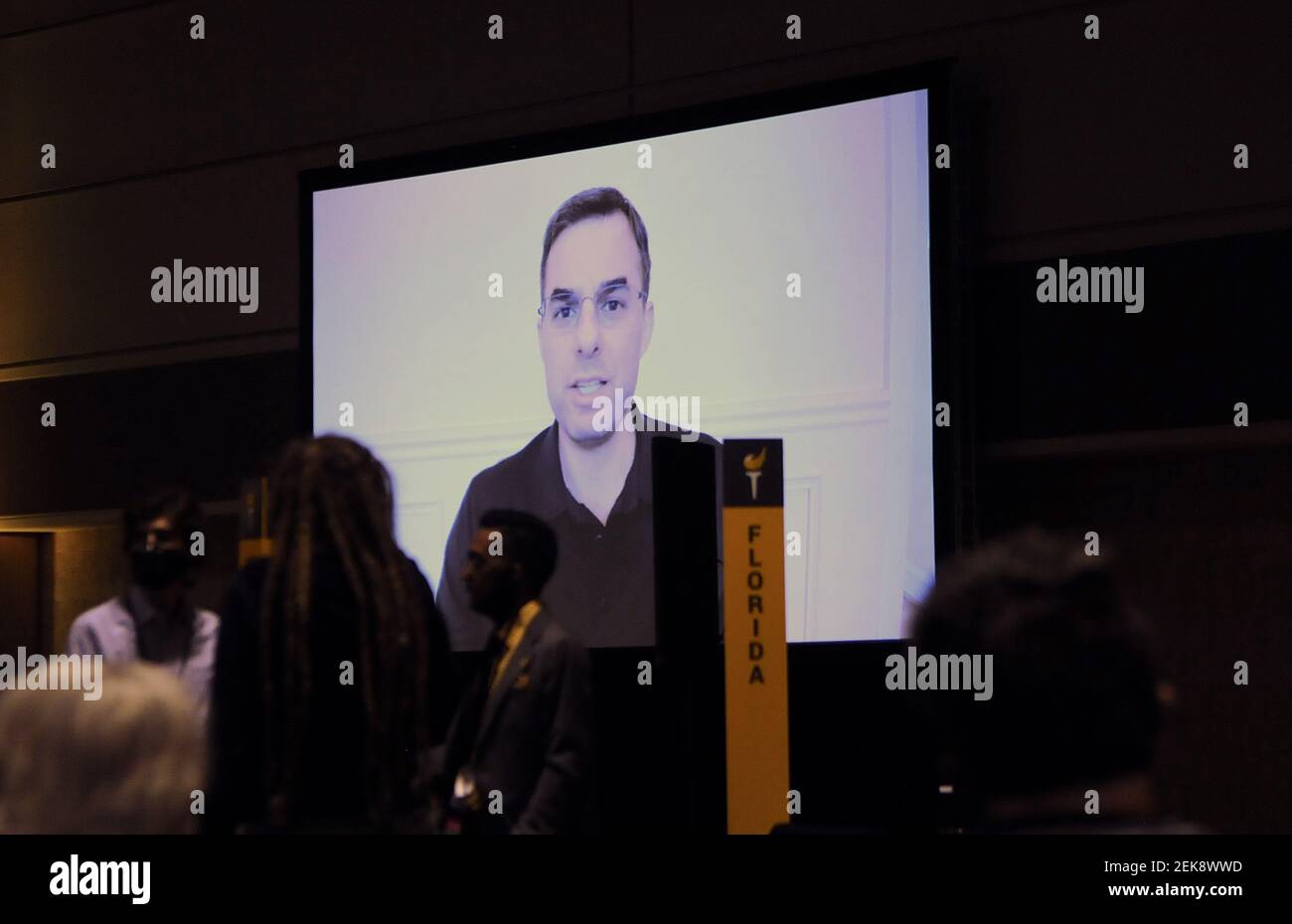 U.S. Congressman Justin Amash of Michigan addresses delegates by video ...
