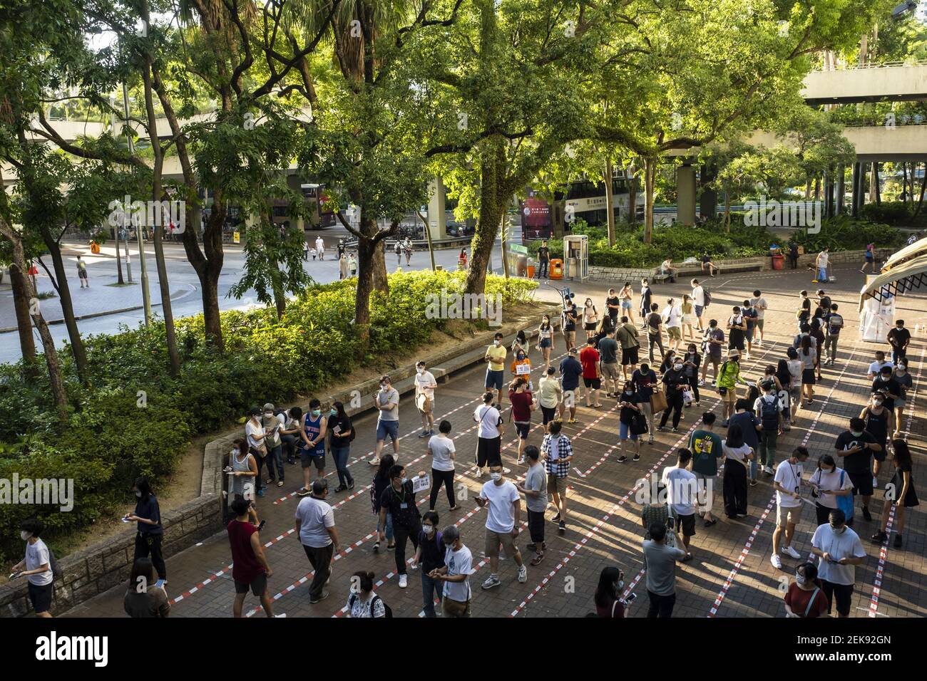 People queue up at a temporary polling station to vote for pro ...