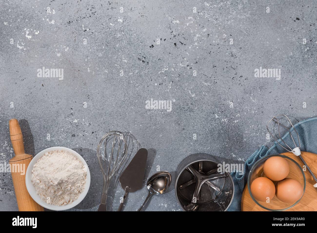 Set of kitchen utensils with products on gray-blue background. Cooking ...