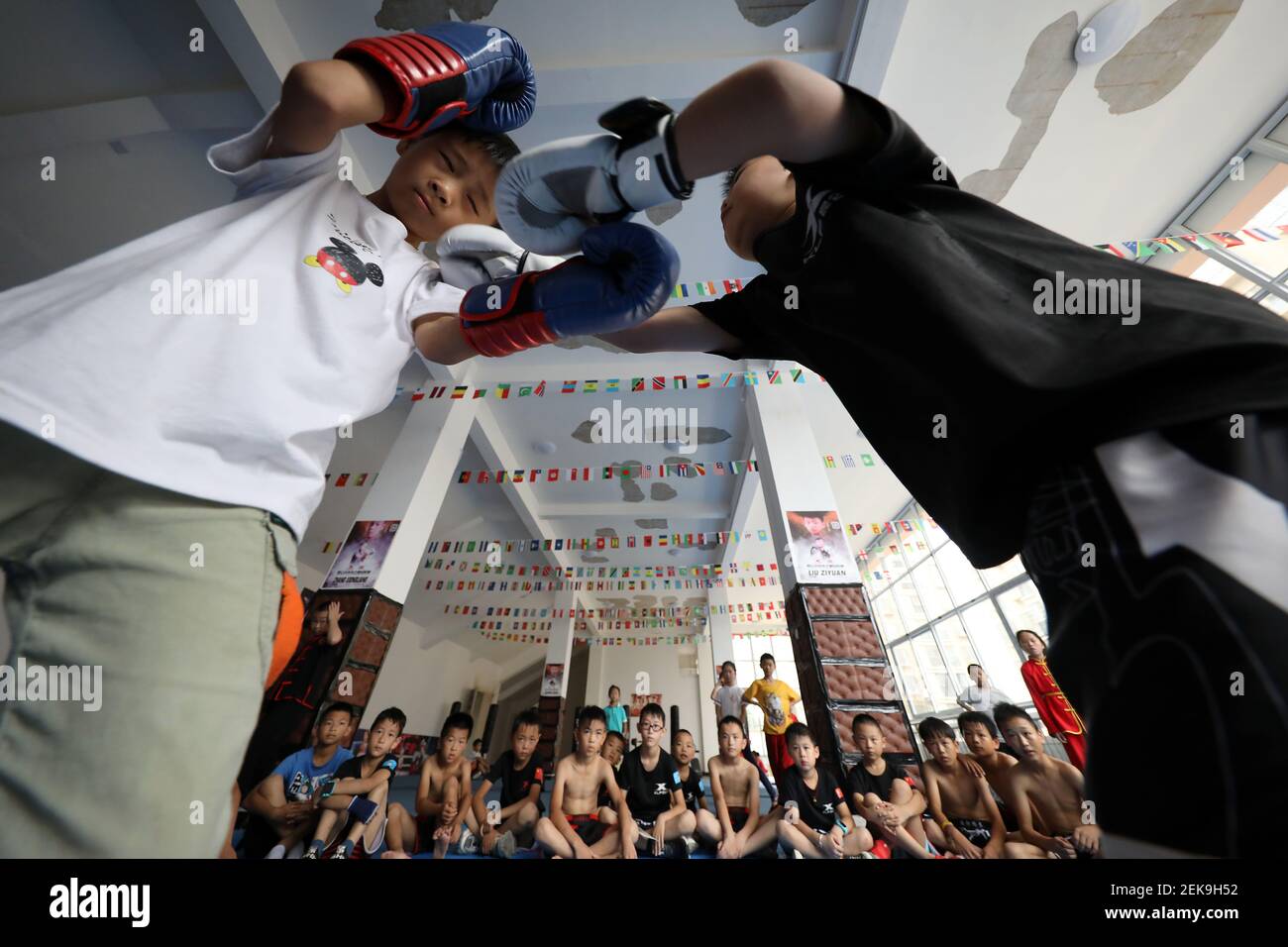 DANZHAI, CHINA - JULY 16, 2020 - Young students practice Sanda fighting ...