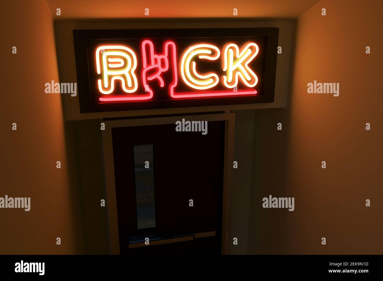 Illuminated rock text with horn sign on door Stock Photo - Alamy