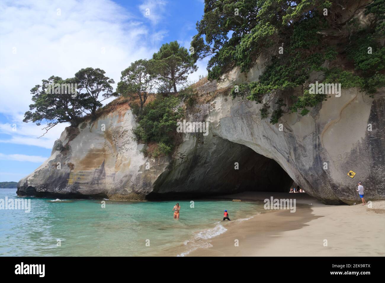 The famous rock archway at Cathedral Cove, a popular tourist ...