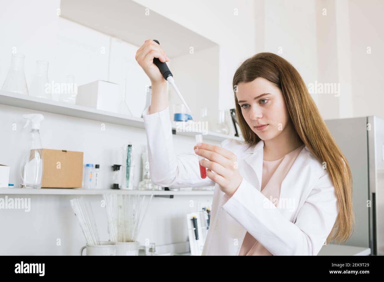 Female scientist pipetting at laboratory Stock Photo - Alamy