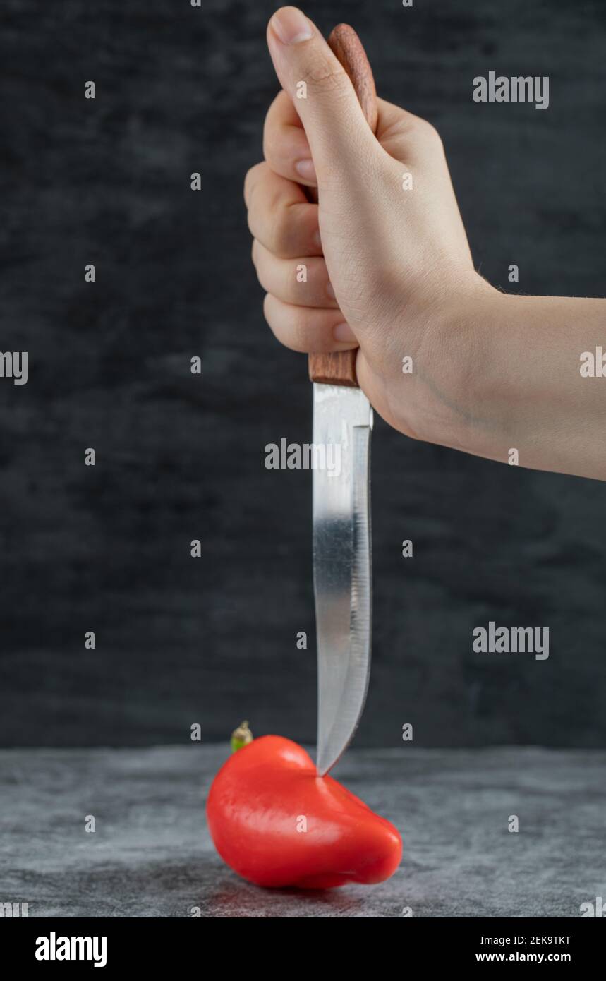 Hand holding pepper hi-res stock photography and images - Alamy