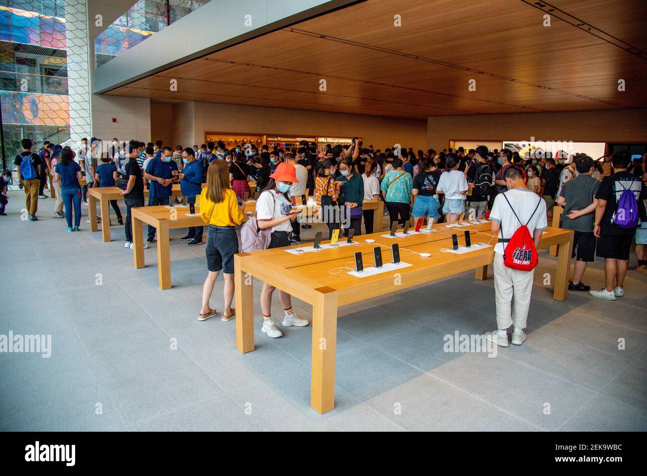 People experience Apple products at the newly-opened Apple Store at ...