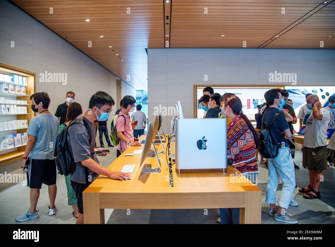 People experience Apple products at the newly-opened Apple Store at ...