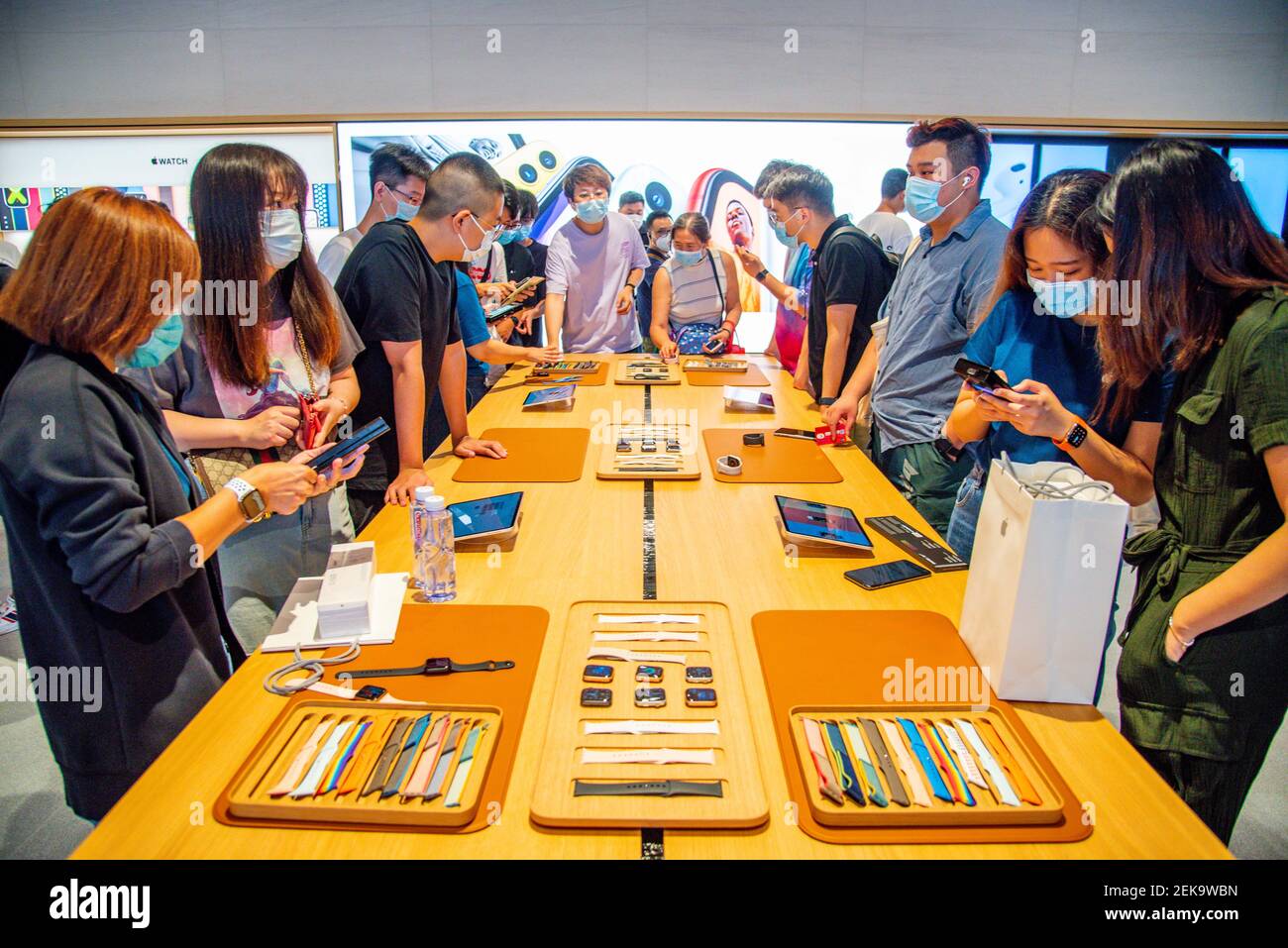 People experience Apple products at the newly-opened Apple Store at ...