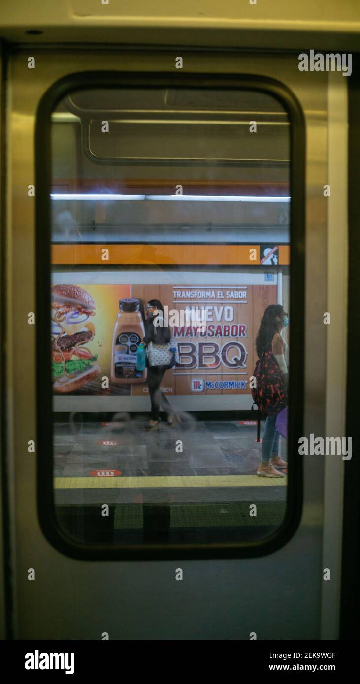 Mayonnaise advertisement and women in Mexico City subway station Stock ...