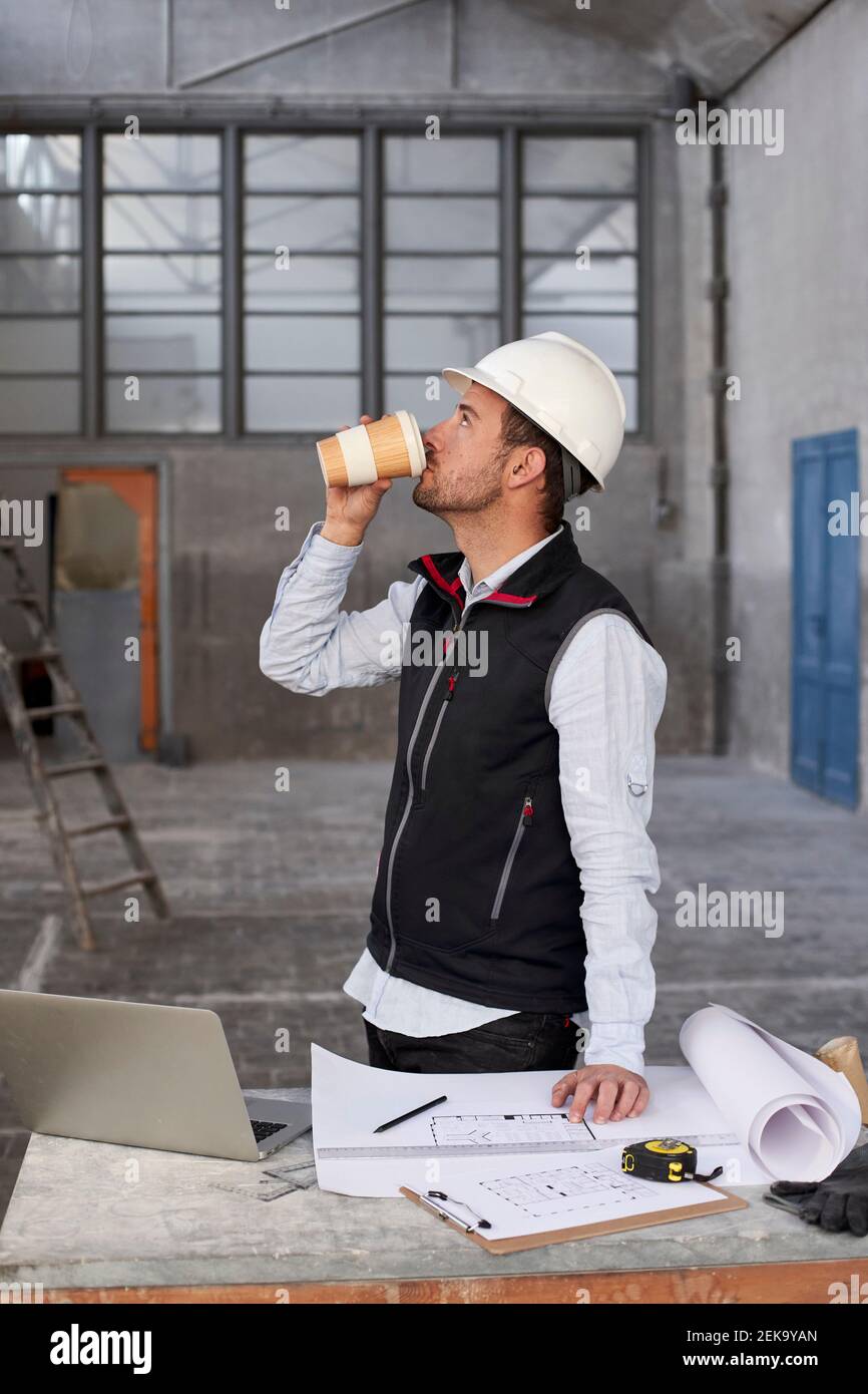 Construction drinking coffee construction site hi-res stock photography ...