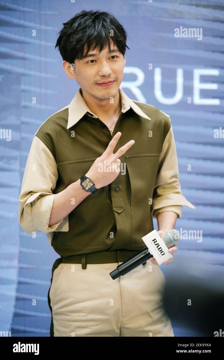 Chinese actor Bai Yu shows off elegance with a shirt on during a ...