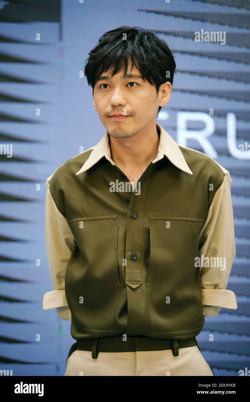 Chinese actor Bai Yu shows off elegance with a shirt on during a ...