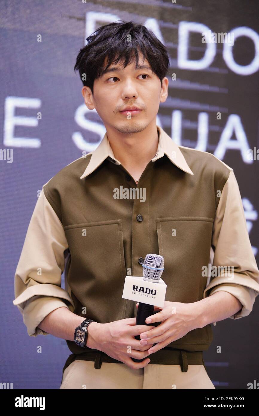 Chinese actor Bai Yu shows off elegance with a shirt on during a ...