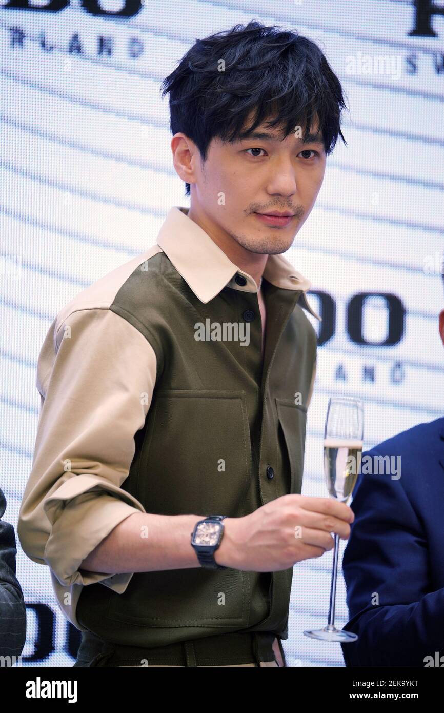 Chinese actor Bai Yu shows off elegance with a shirt on during a promotional event, Shanghai ...