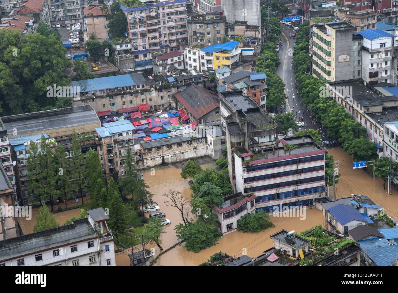 An aerial view of department buildings submerged by flood in Enshi ...