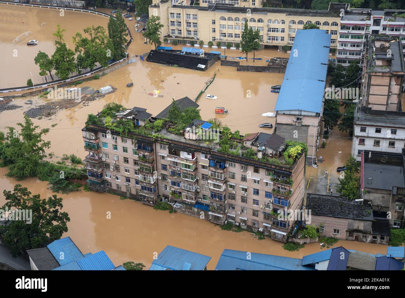 An aerial view of department buildings submerged by flood in Enshi ...