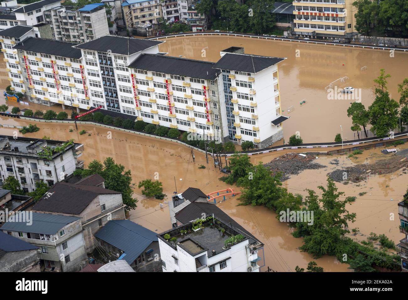 An aerial view of department buildings submerged by flood in Enshi ...