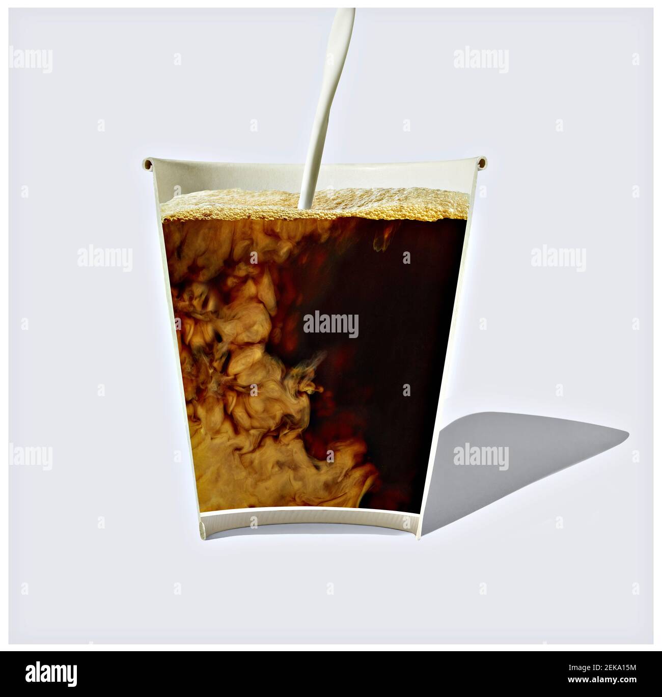 Cross section of milk mixing with coffee inside disposable cup Stock ...