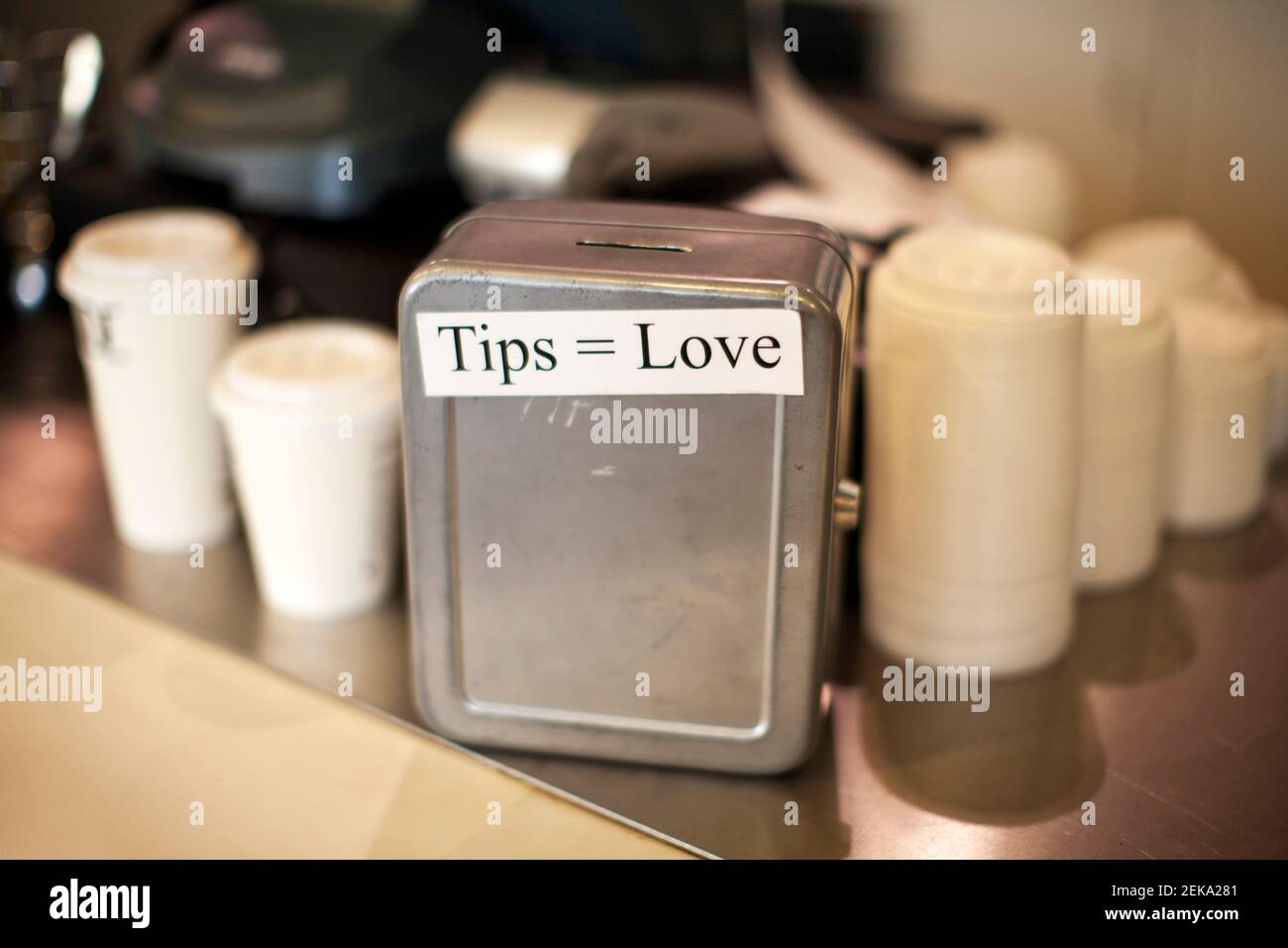 Metallic tips box at cafe Stock Photo - Alamy