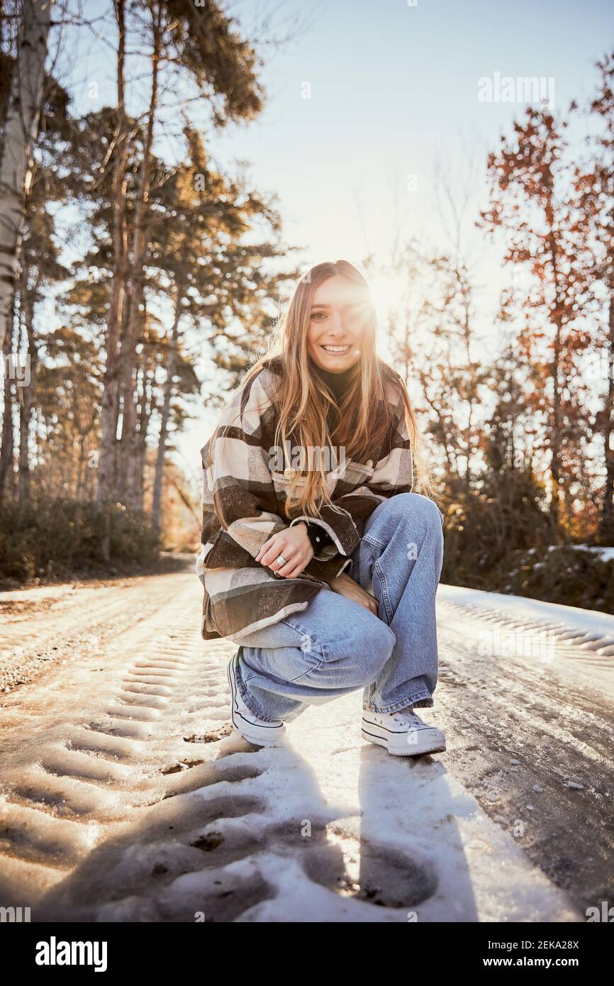 Portrait young woman crouching on hi-res stock photography and images ...