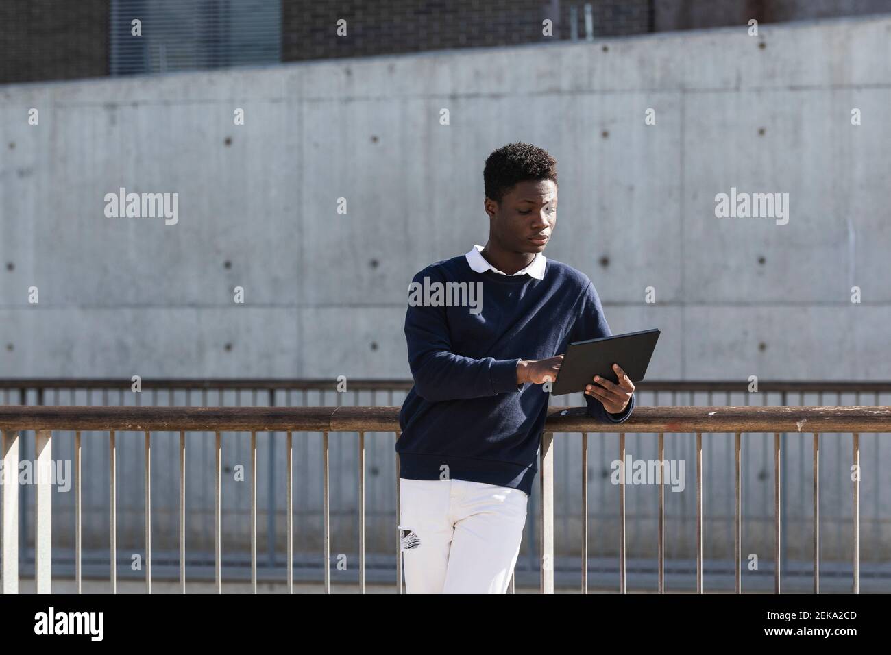 Man Leaning Against Railing High Resolution Stock Photography and ...