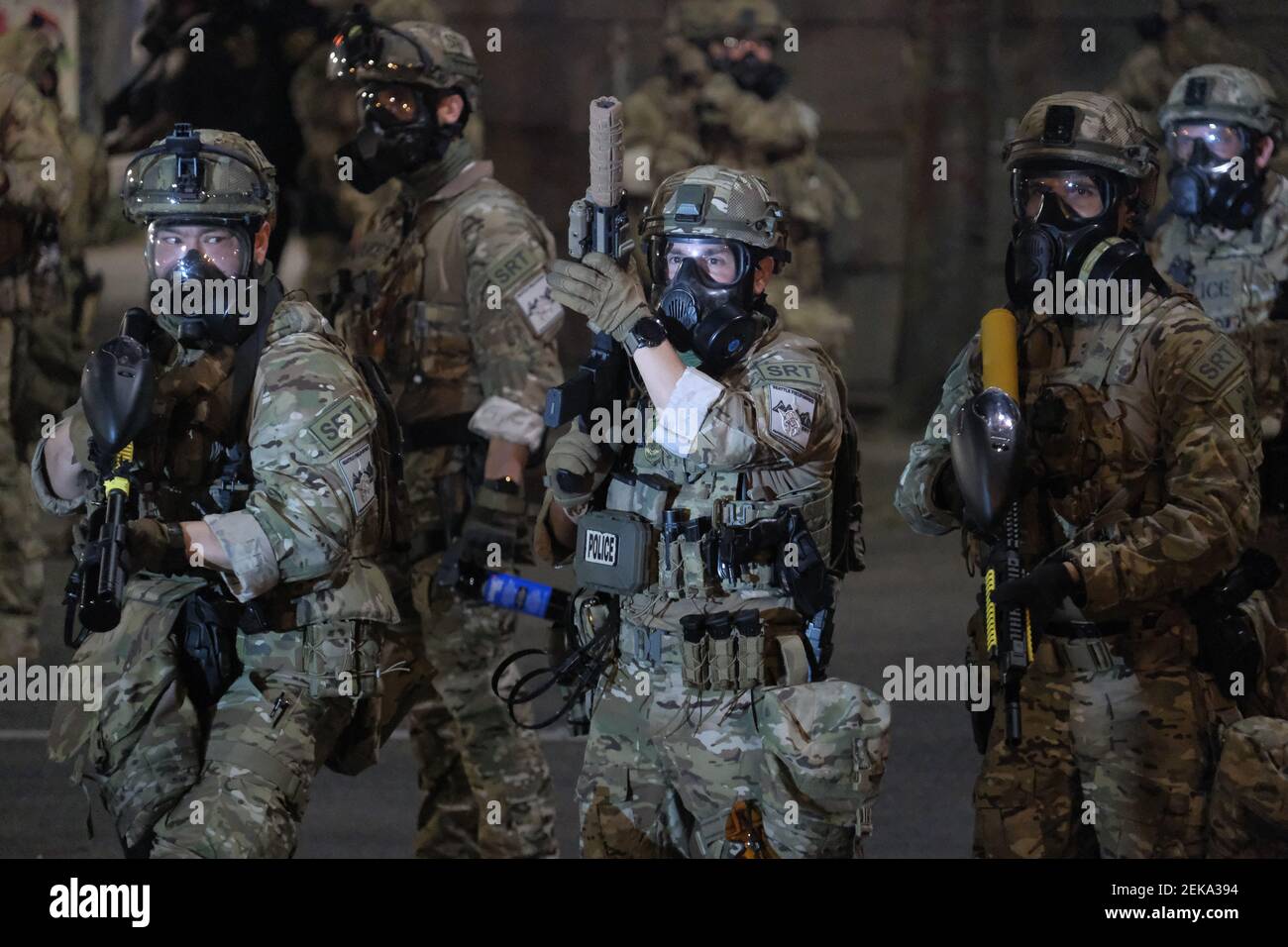 Federal officers take up positions outside the Justice Center after ...