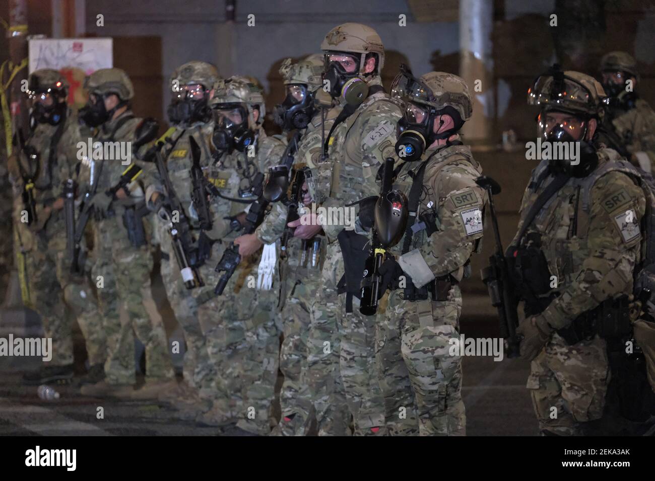 Federal officers take up positions outside the Justice Center after ...