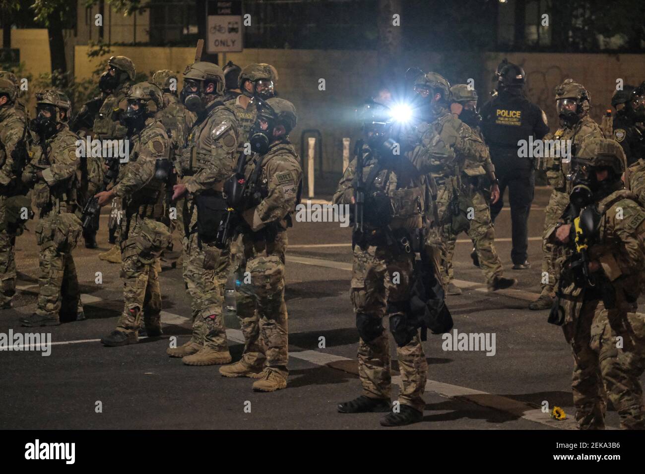 Federal officers line up near the Edith Green Wendell Wyatt federal ...