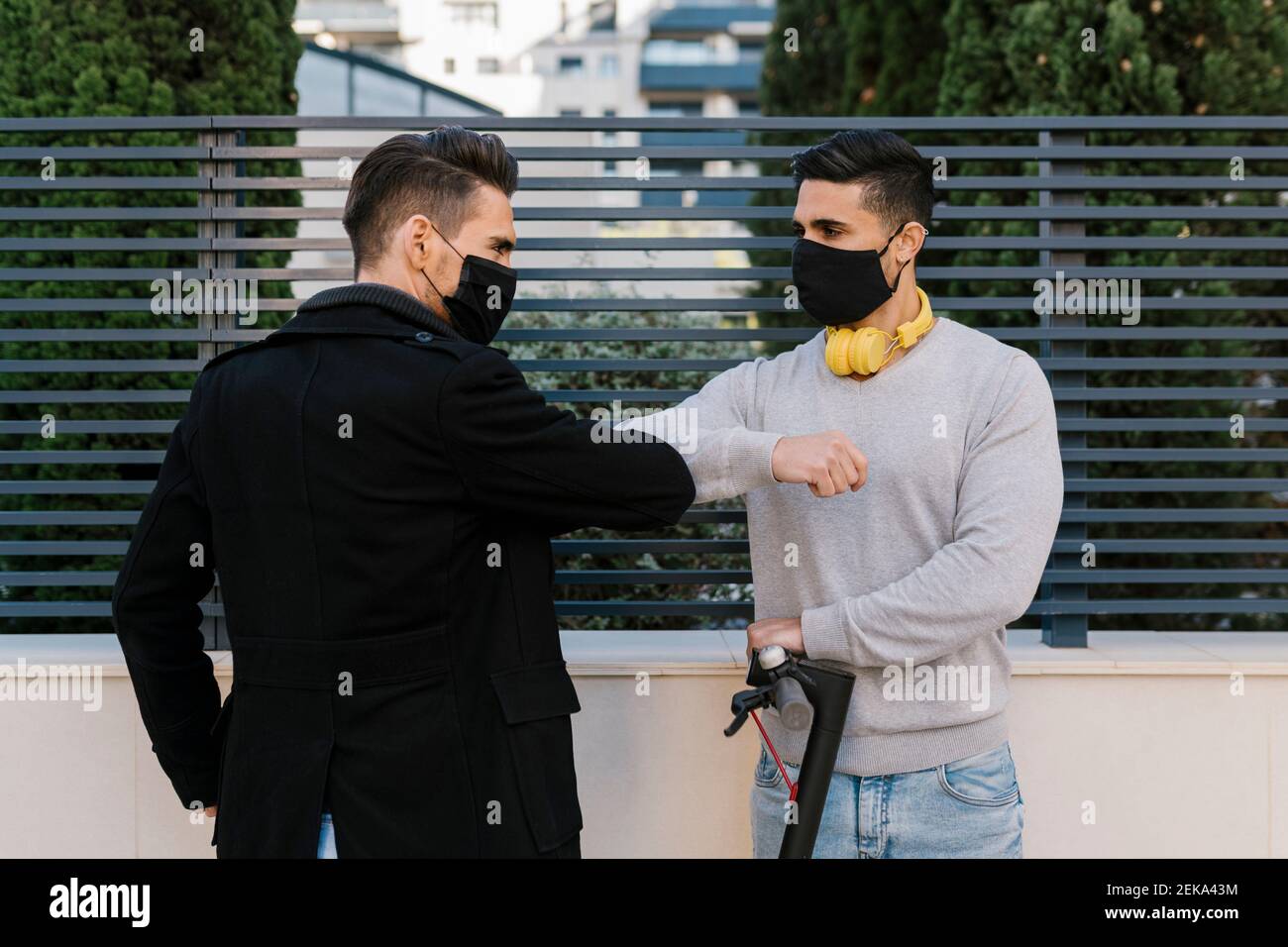 Male friends greeting hi-res stock photography and images - Alamy