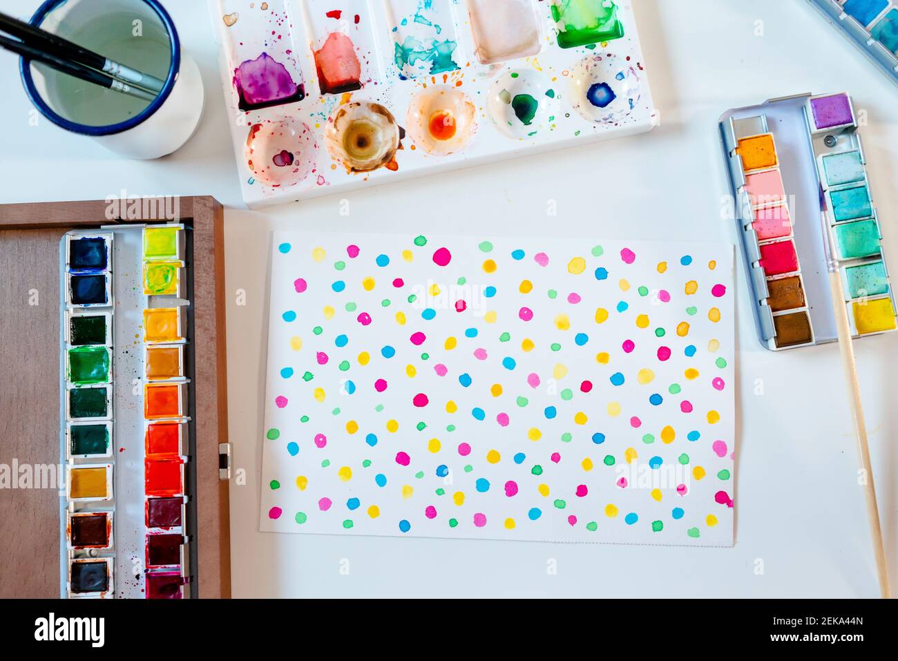 Colorful watercolor abstract dots pattern on white paper background ...