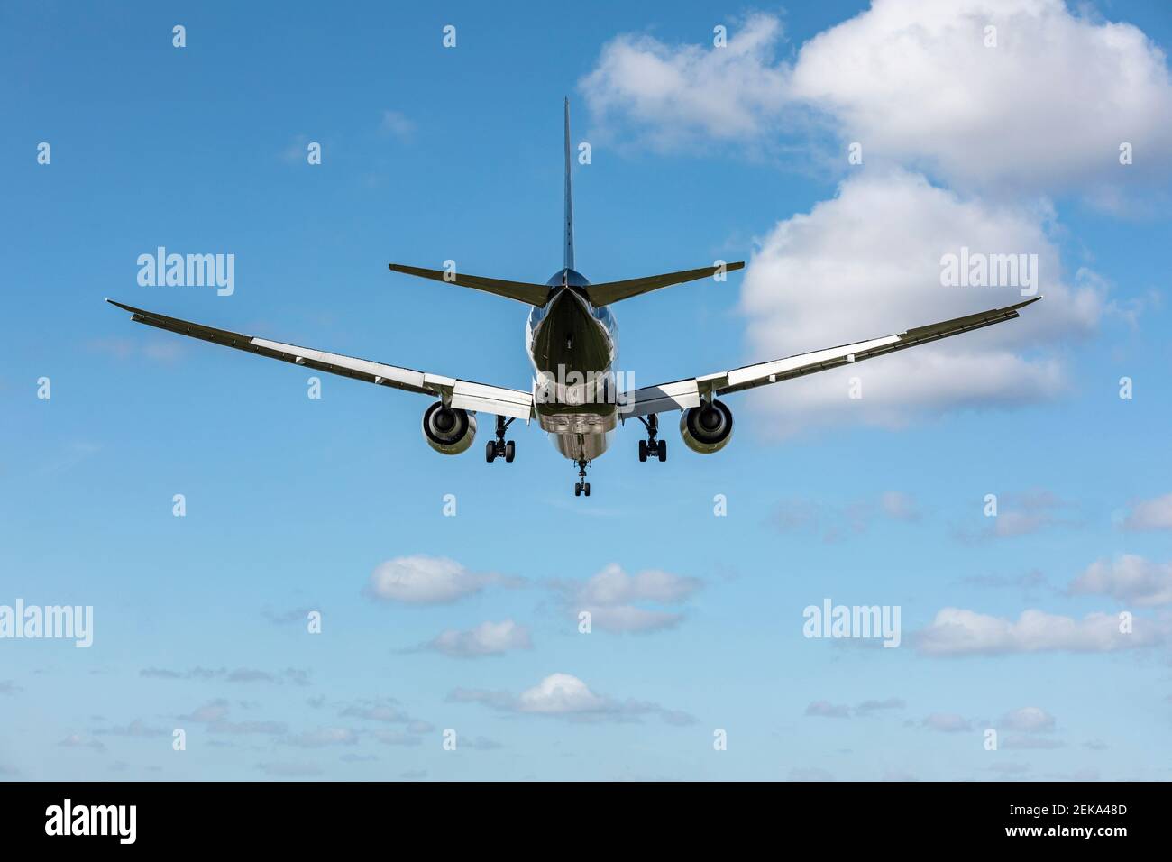 Commercial airplane preparing to land Stock Photo - Alamy