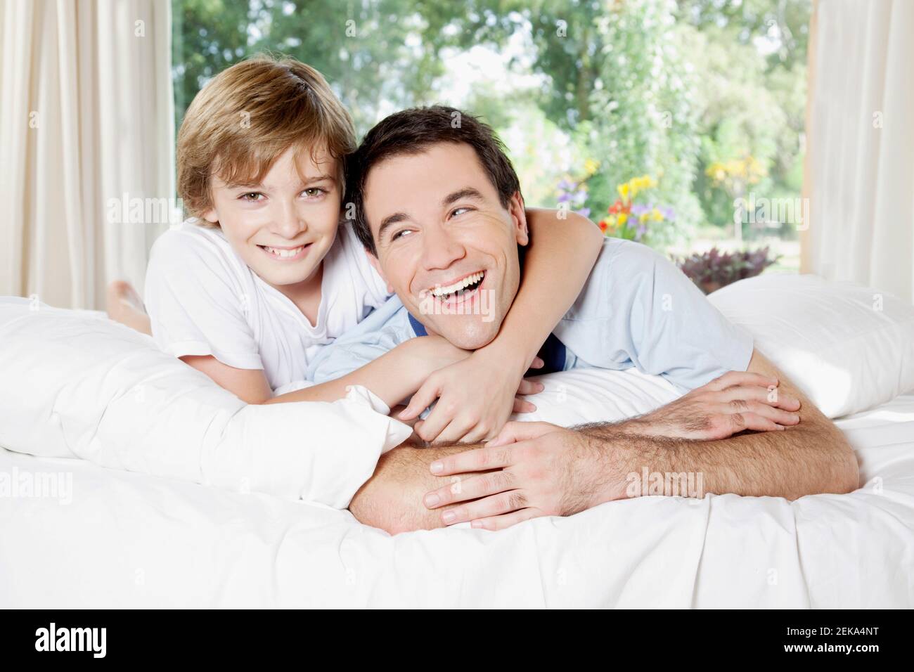 Boy holding his father in headlock Stock Photo - Alamy