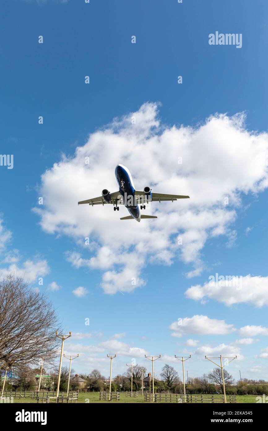Commercial airplane preparing to land Stock Photo - Alamy