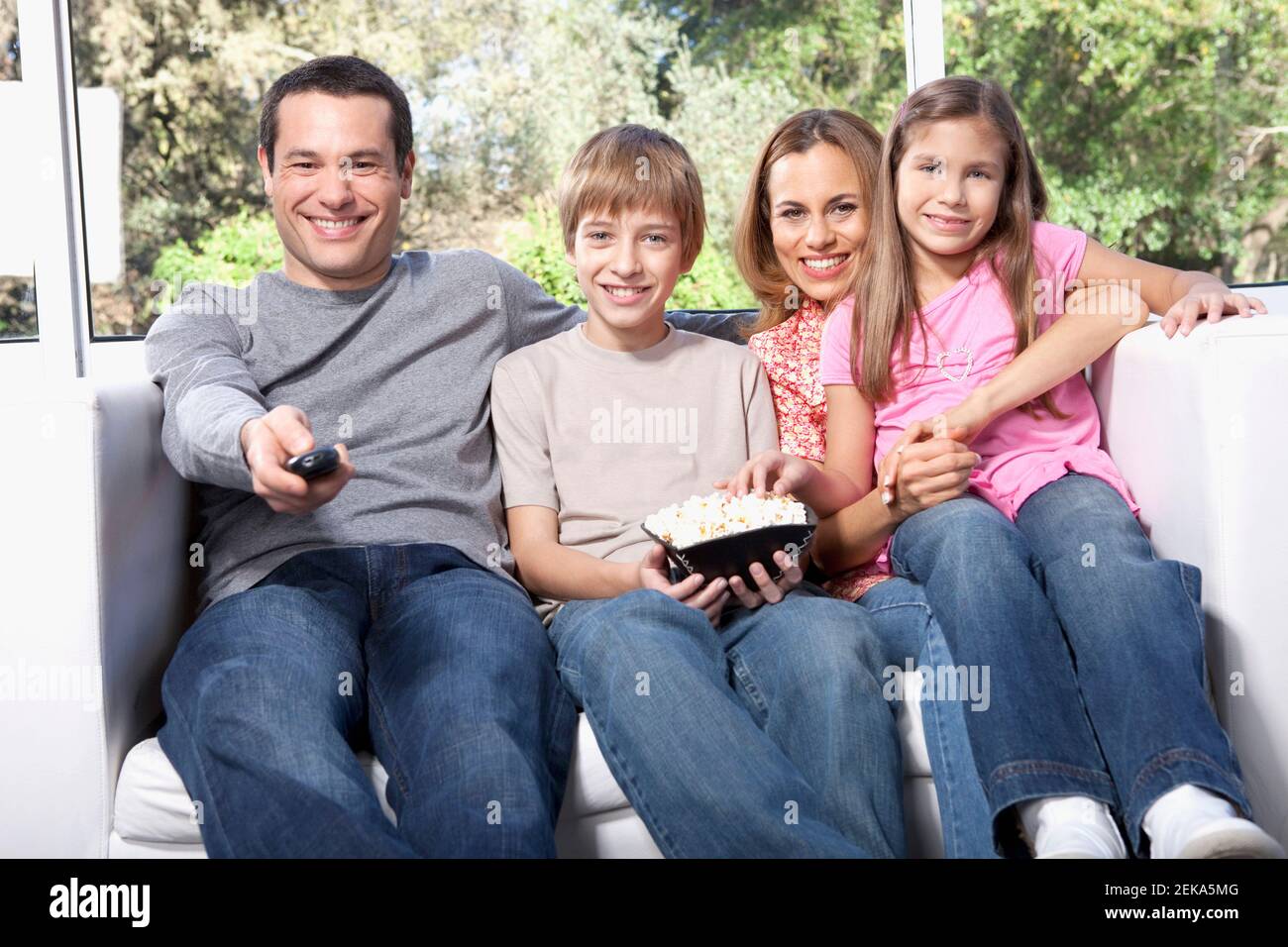 Family watching television Stock Photo - Alamy