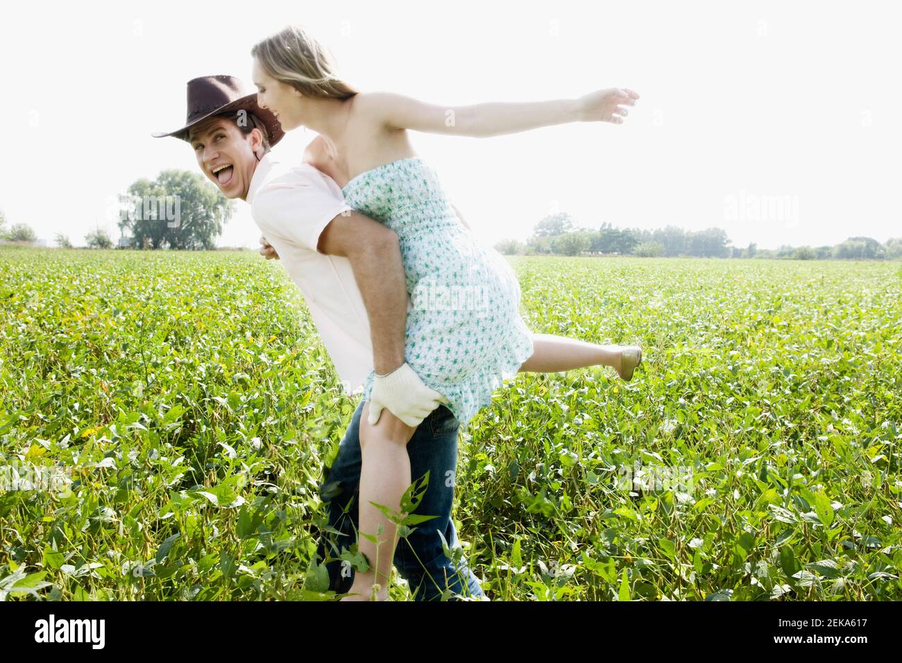 Woman riding piggyback on a man Stock Photo - Alamy