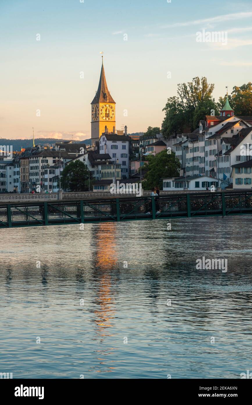 Bridge over Limmat river with St. Peter's and Fraumunster Church at ...