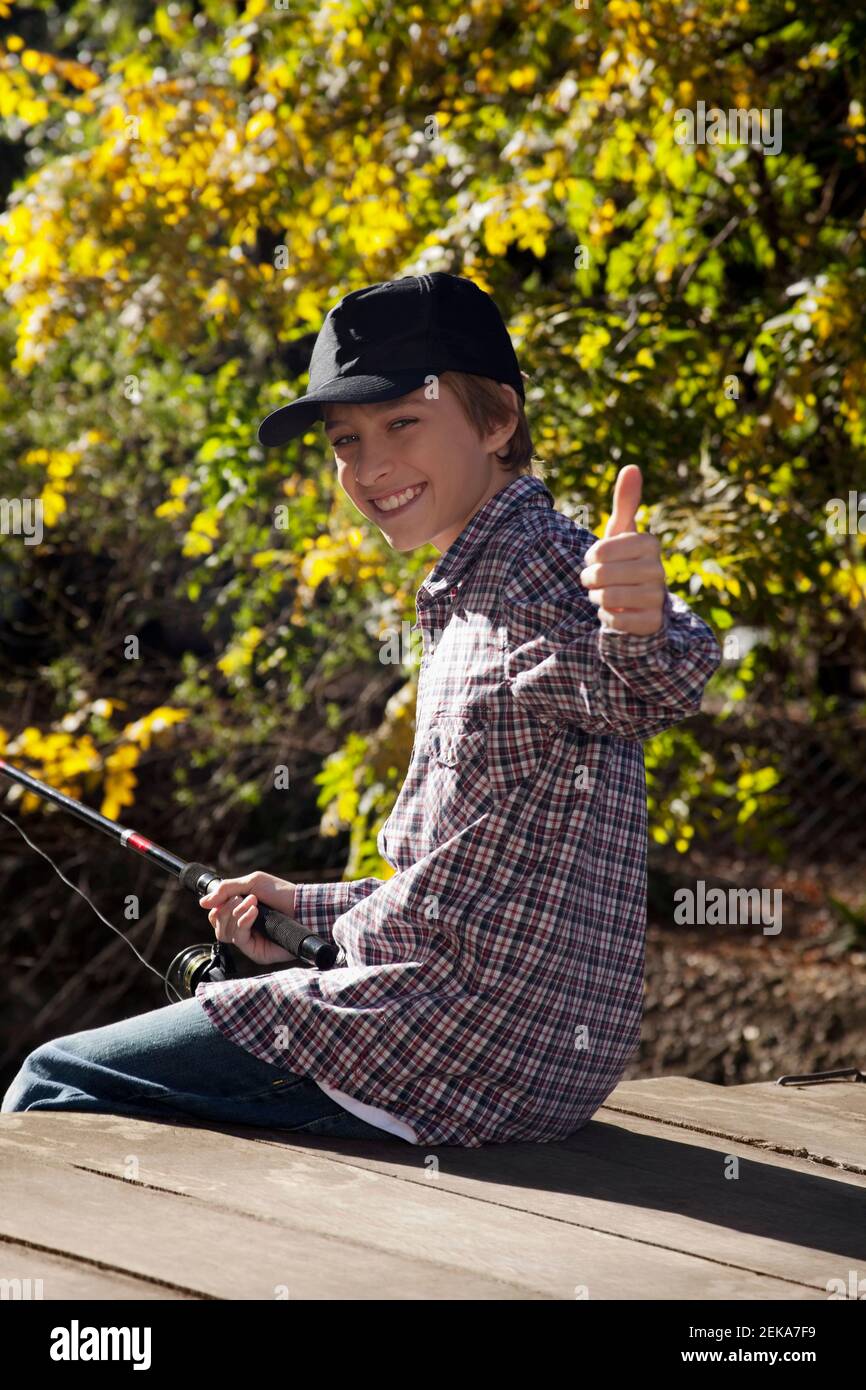 Portrait of a boy fly fishing Stock Photo - Alamy